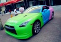 A Nissan GT-R in lime-green, blue and Pink from China