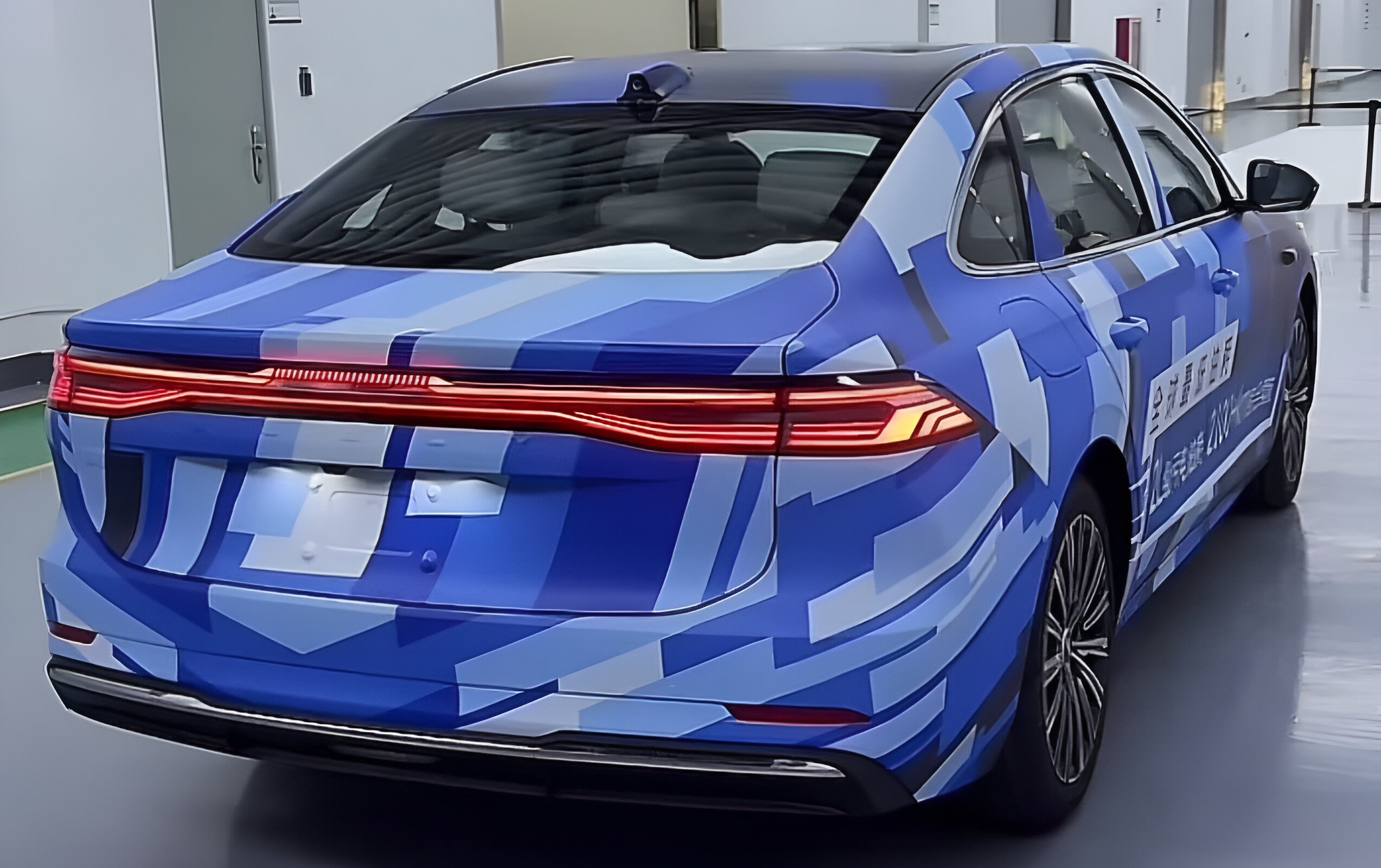 Spy shots reveal Geely's 2,100km hybrid sedan - one of four NEVs coming ...